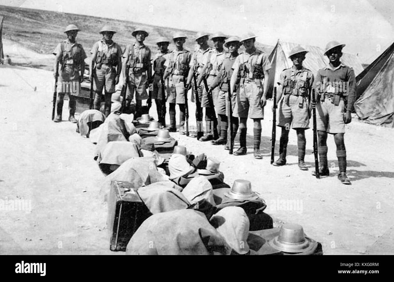 A photograph showing soldiers with weapons, depicting a military group ...