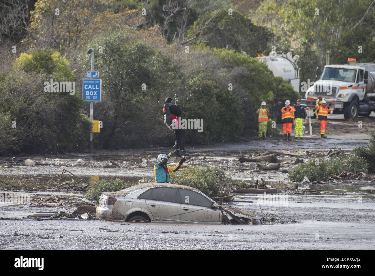 Montecito, California, USA. 9th January, 2018. A man gets rescued from ...