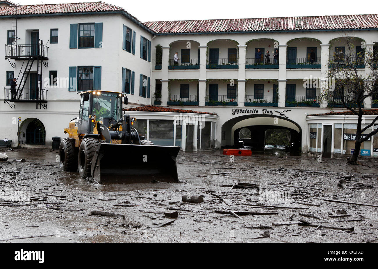 Montecito, California, USA. 10th Jan, 2018. Debris is cleared in front ...