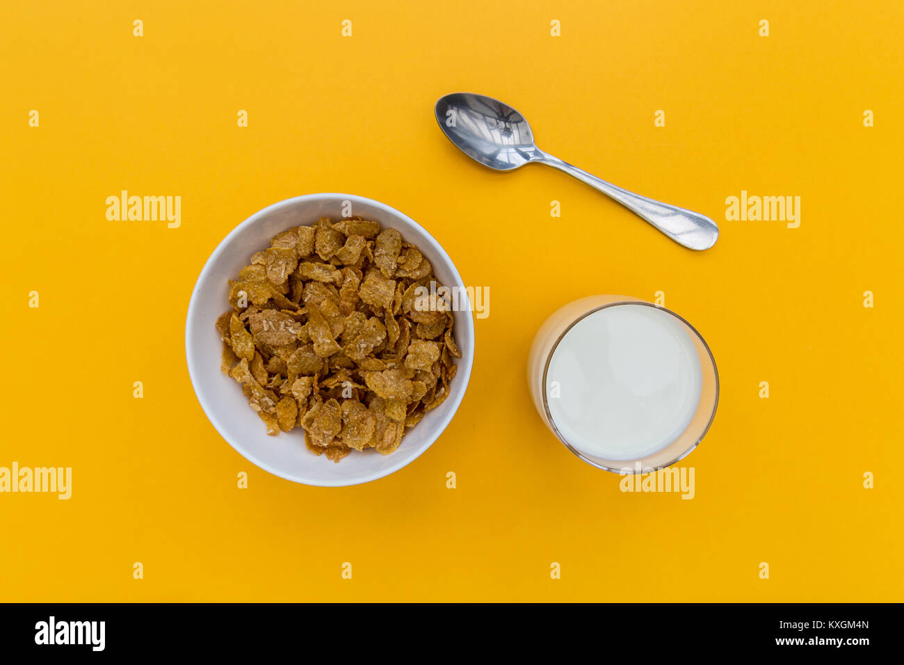 Breakfast cornflakes cereal with milk on bright yellow background Stock ...