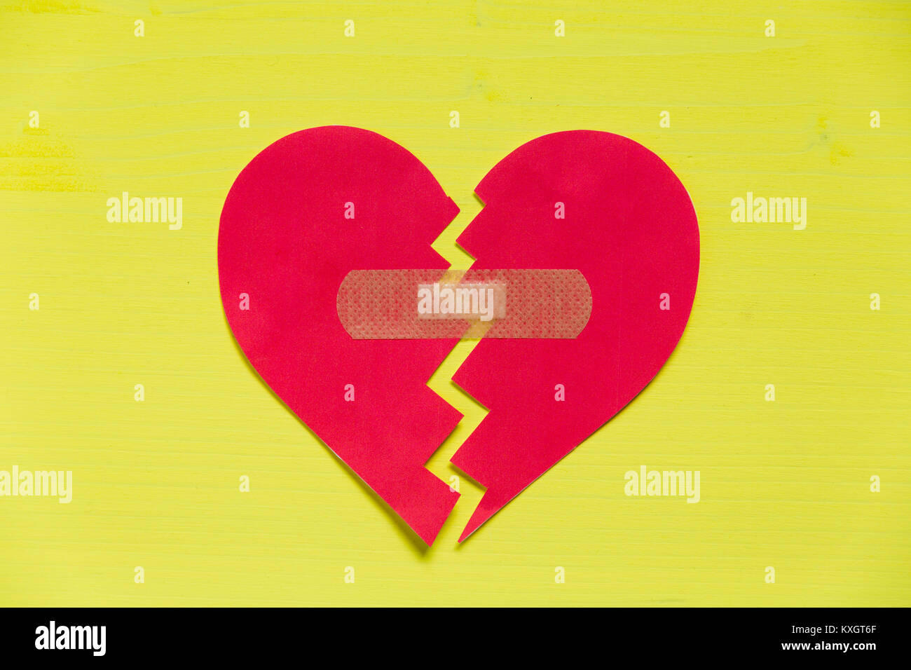 Broken paper heart with patch Stock Photo - Alamy