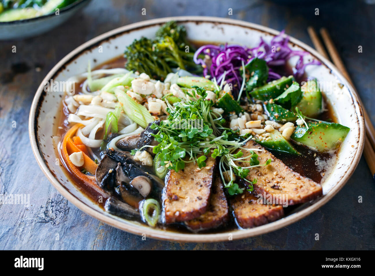 Vegetarian ramen with smoked tofu, pickled cabbage and cucumber Stock ...