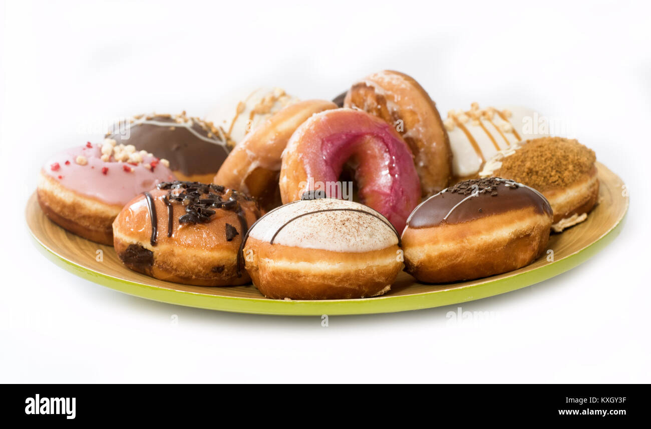 Many colorful donuts flavors in big dish against white background Stock ...