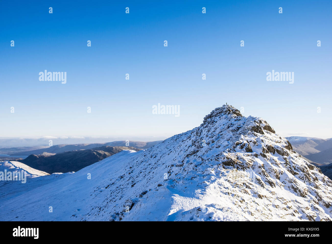 A Mountaineer taking on Striding Edge Ridge on The Helvellyn Mountain ...