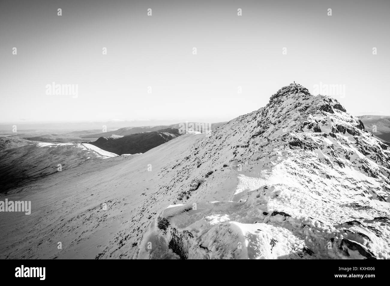 A Mountaineer taking on Striding Edge Ridge on The Helvellyn Mountain ...