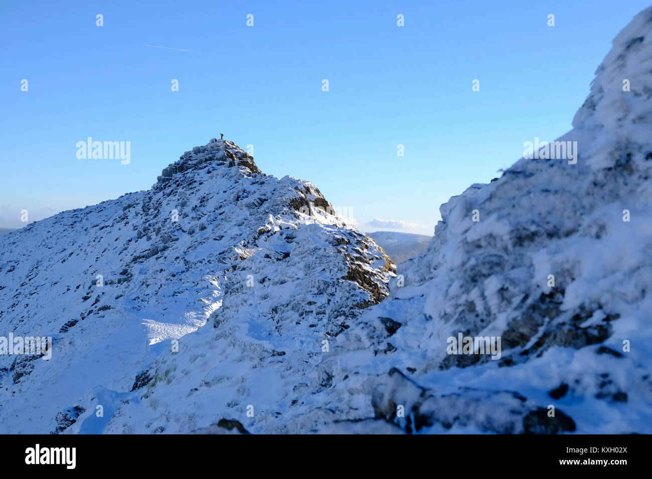 A Mountaineer taking on Striding Edge Ridge on The Helvellyn Mountain ...