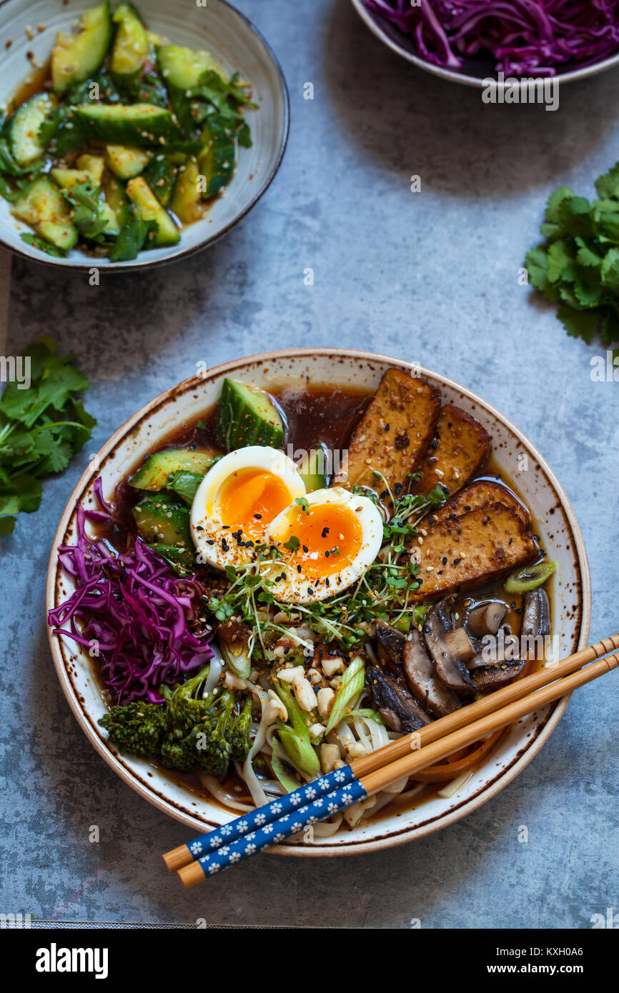 Vegetarian ramen with smoked tofu, pickled cabbage and cucumber Stock ...