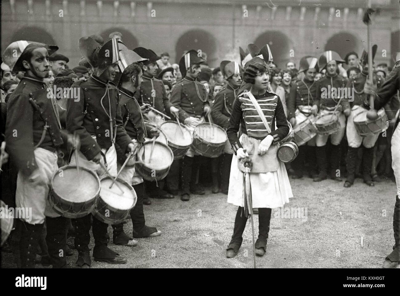 This image shows a traditional tamborrada parade in the Plaza de la ...