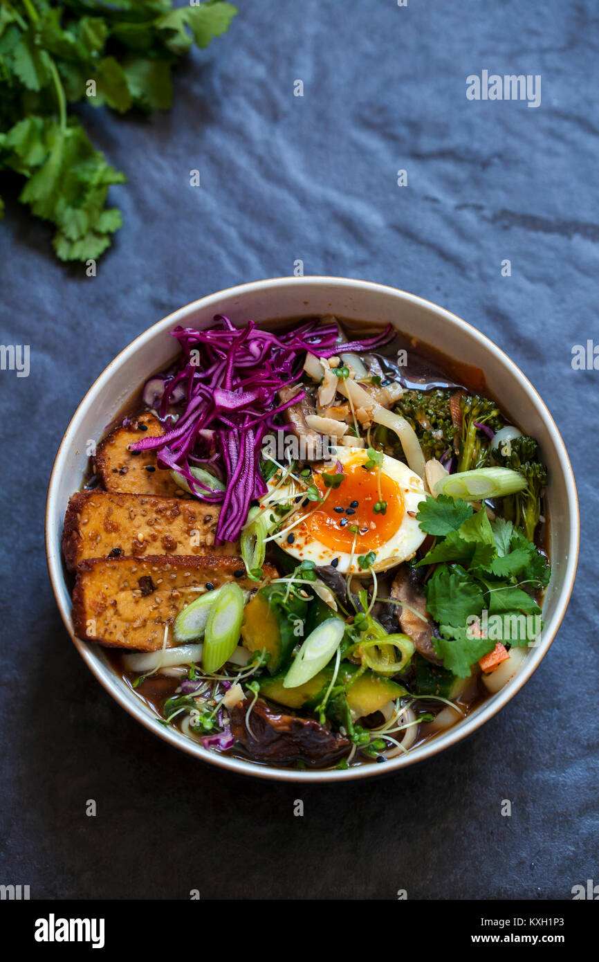 Vegetarian ramen with smoked tofu, pickled cabbage and cucumber Stock ...