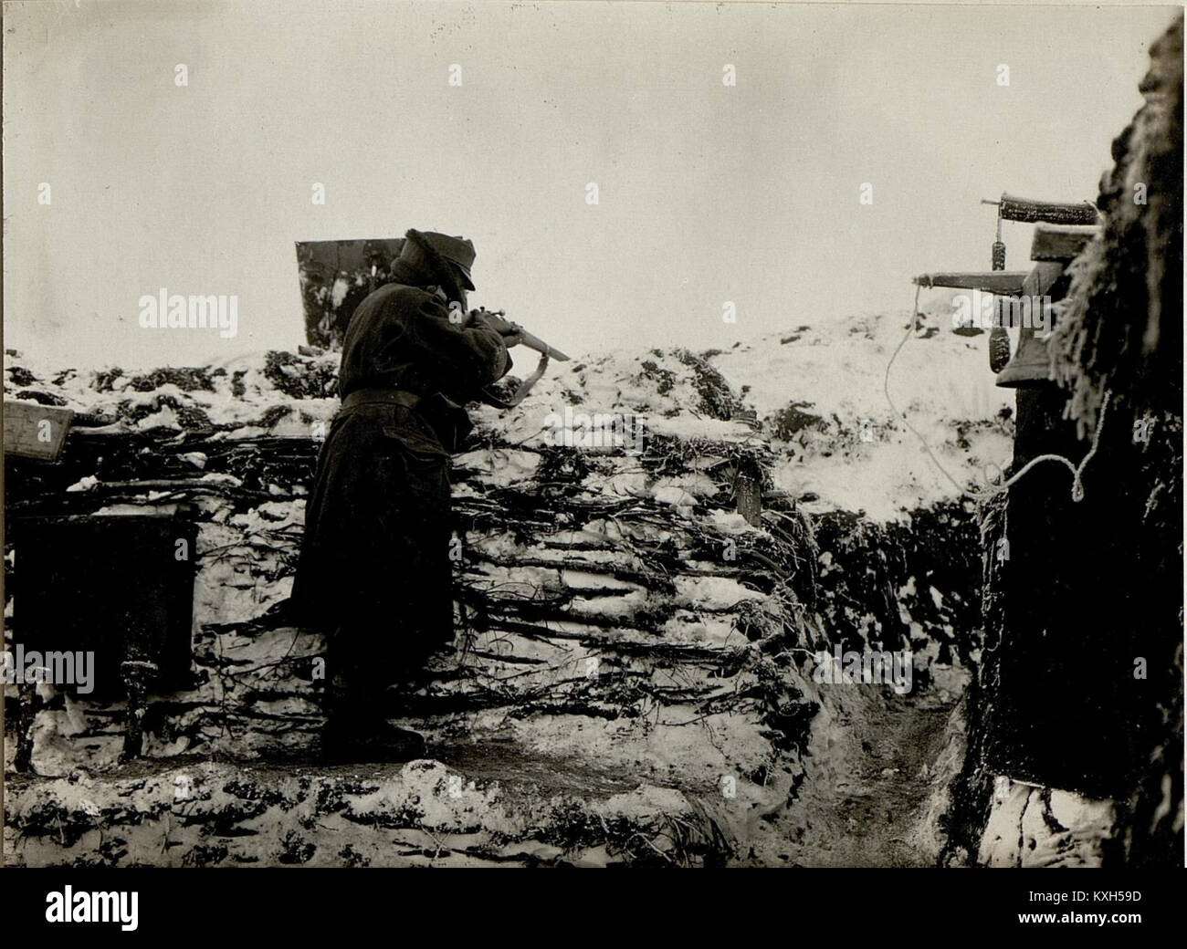 A 1917 photograph of an alarm post with a bell used by the 8th Company ...