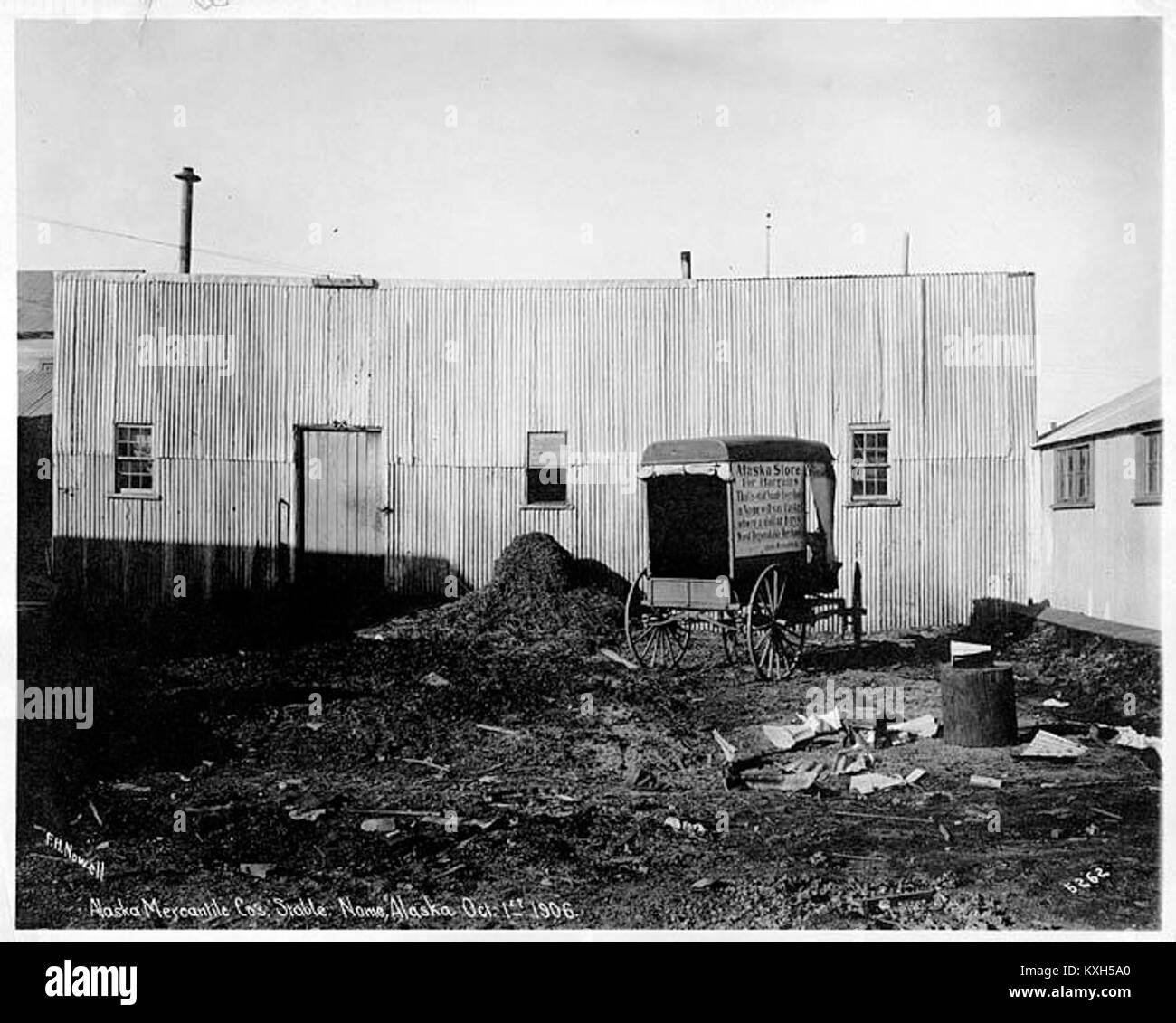 The photograph depicts the Alaska Mercantile Company's stable in Nome ...
