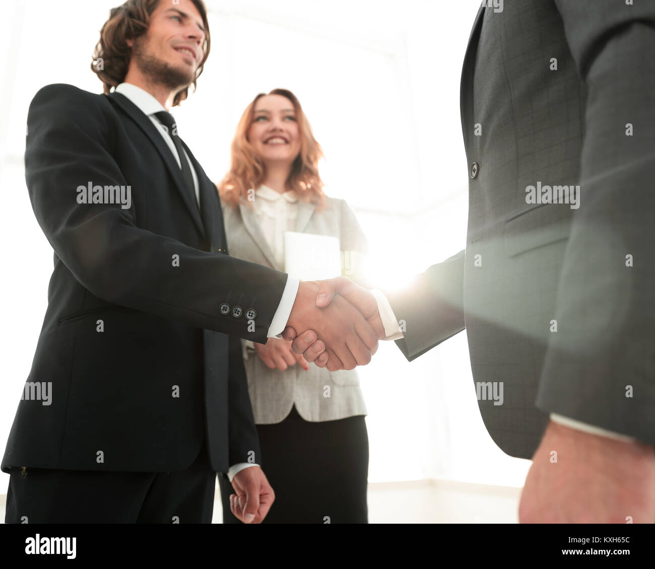 Photo of handshake of two happy businessmen Stock Photo - Alamy