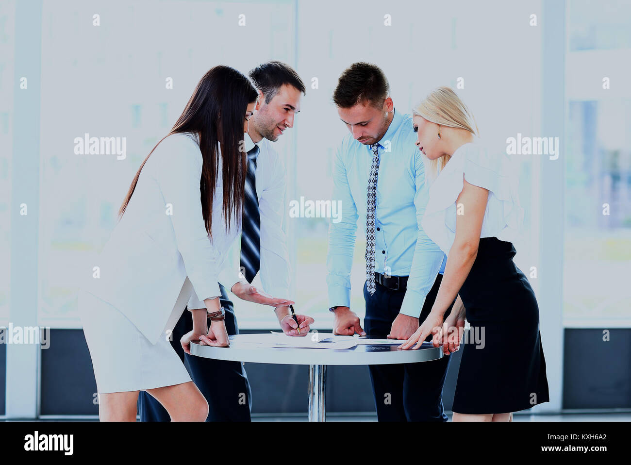 Business meeting - manager discussing work with his colleagues Stock ...