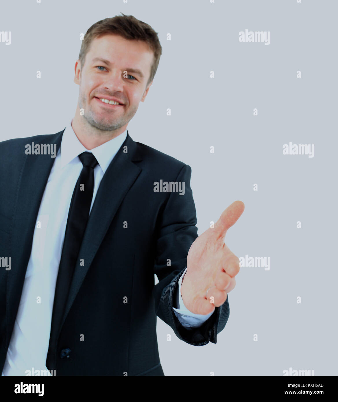 Business man saying welcome and giving hand Stock Photo - Alamy