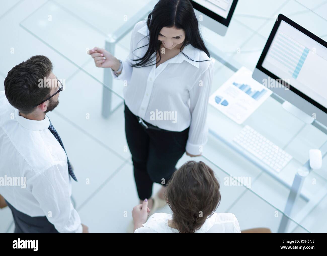 company employees are talking in the office Stock Photo - Alamy
