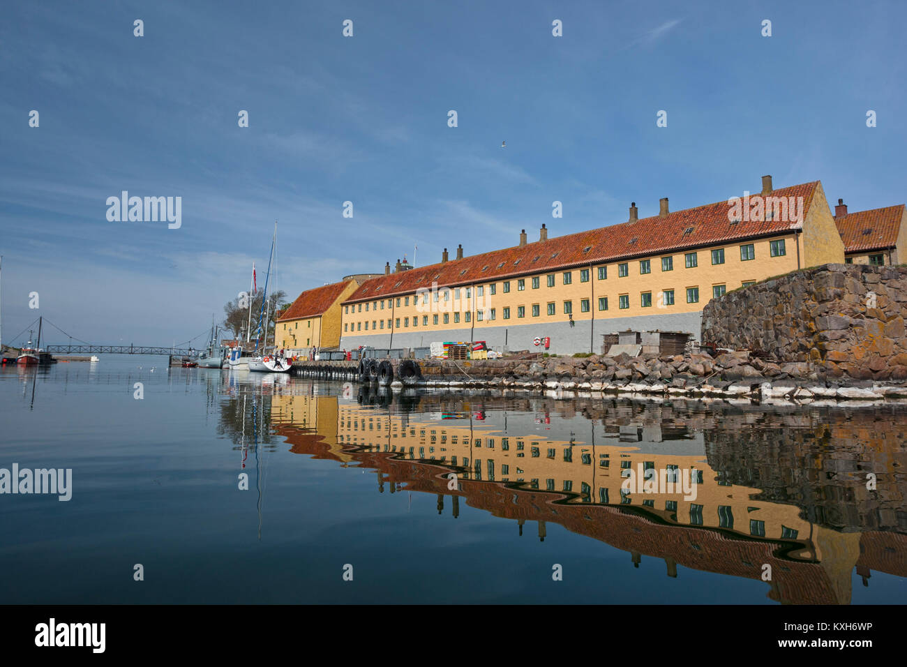 Yellow residential buildings seen from the harbour, Christiansø ...