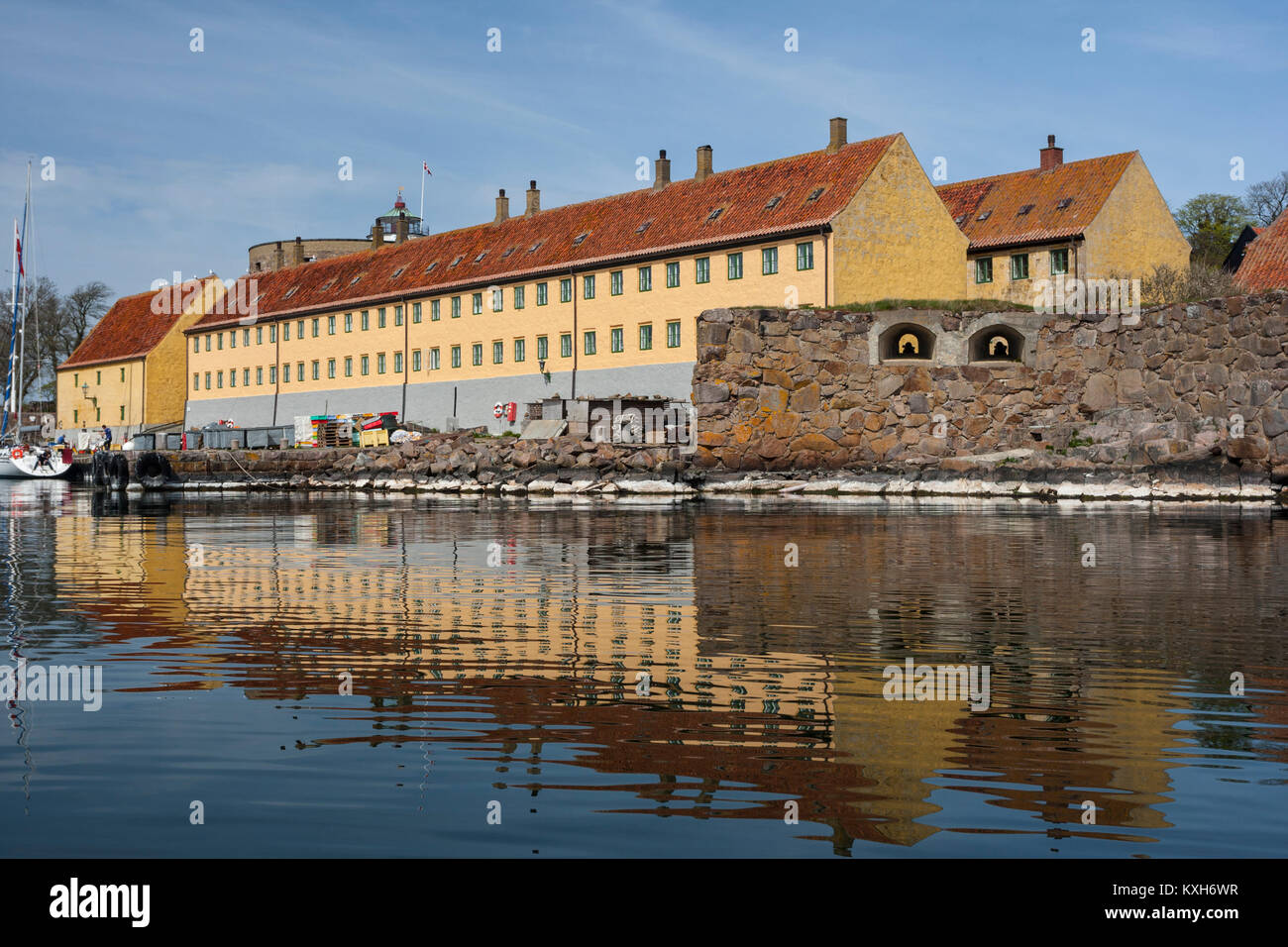 Yellow residential buildings seen from the harbour, Christiansø ...