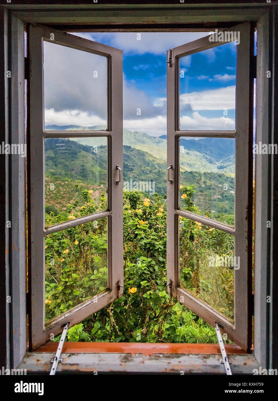 Open window looking at blue mountains of Jamaica Stock Photo - Alamy