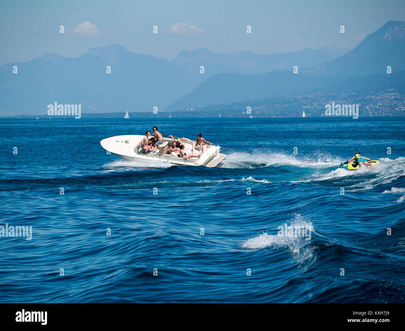 Having fun in a water boat at lake Geneva Stock Photo - Alamy