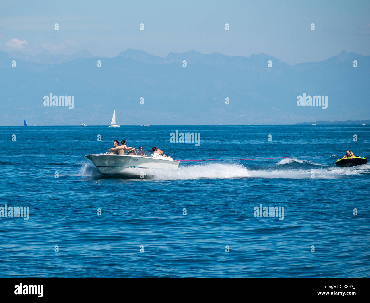 Having fun in a water boat at lake Geneva Stock Photo - Alamy