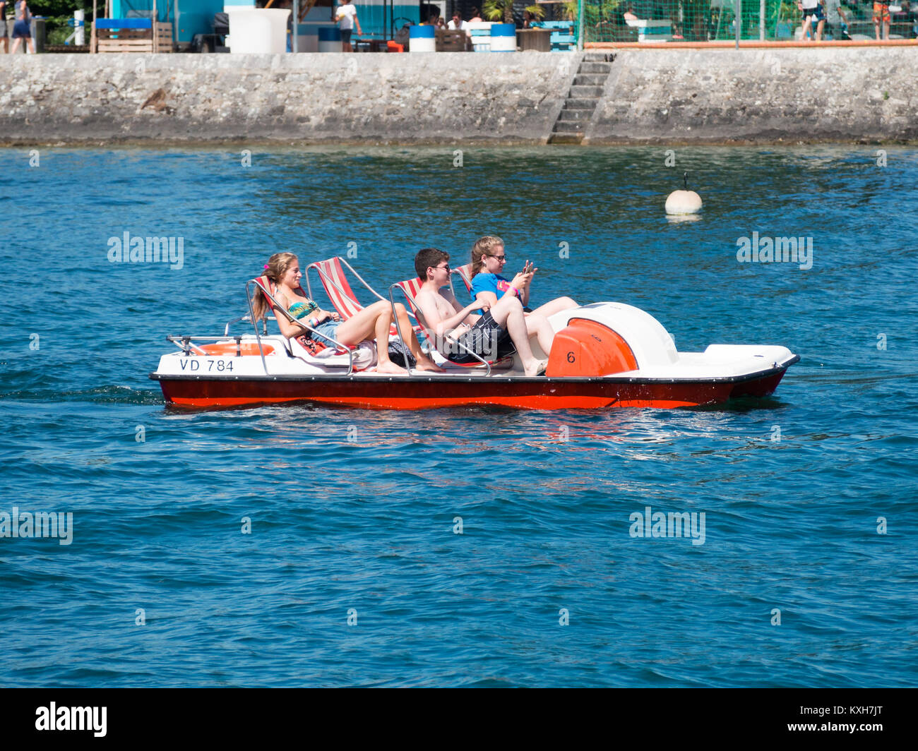 Paddle boating in Lake Geneva Stock Photo - Alamy