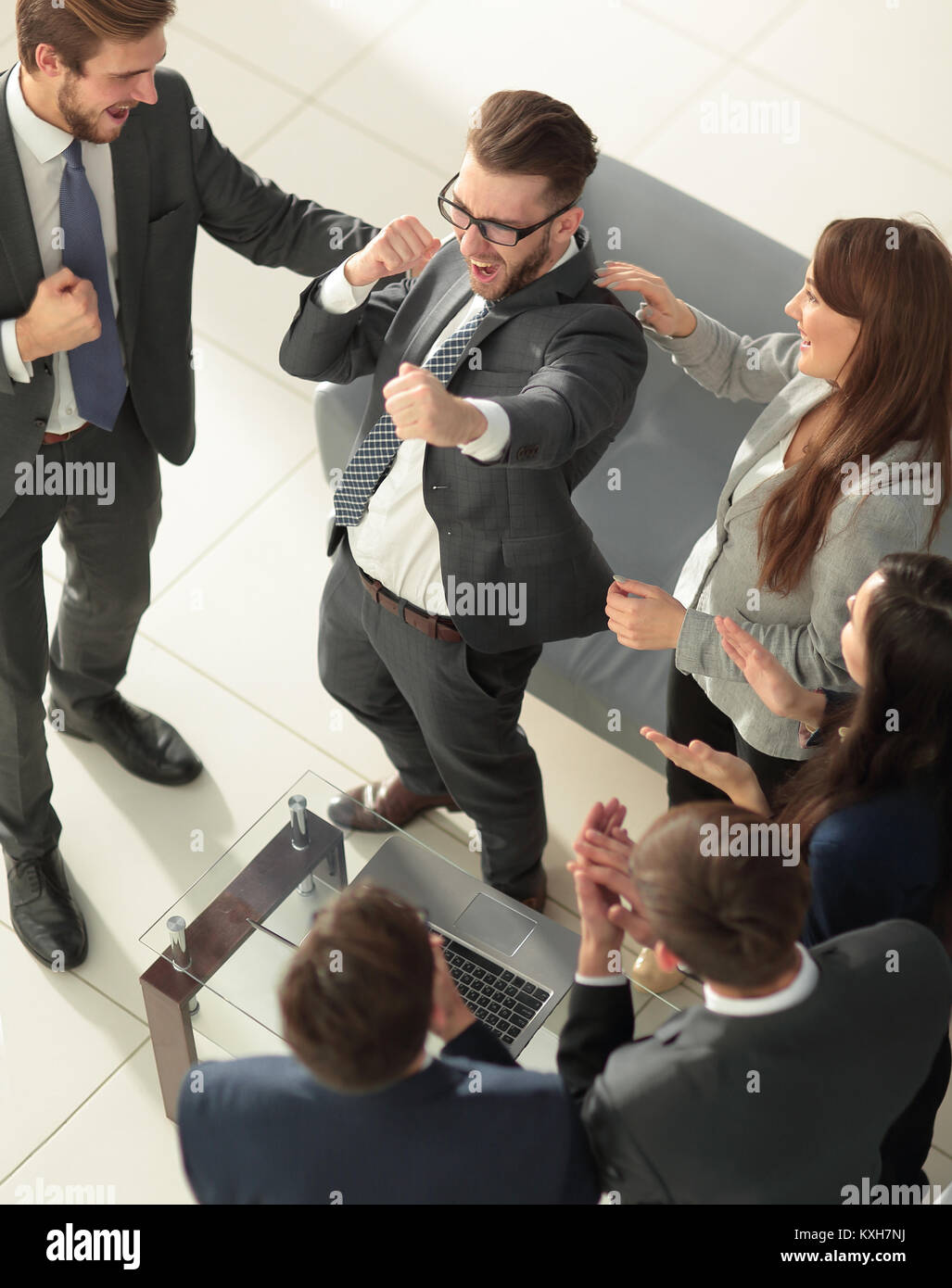 Positive colleagues giving high five Stock Photo - Alamy