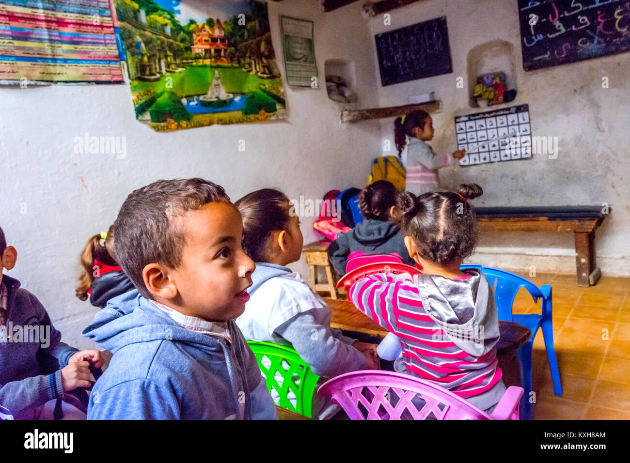 FEZ, MOROCCO - DECEMBER 10: School girl standing in front of the class ...