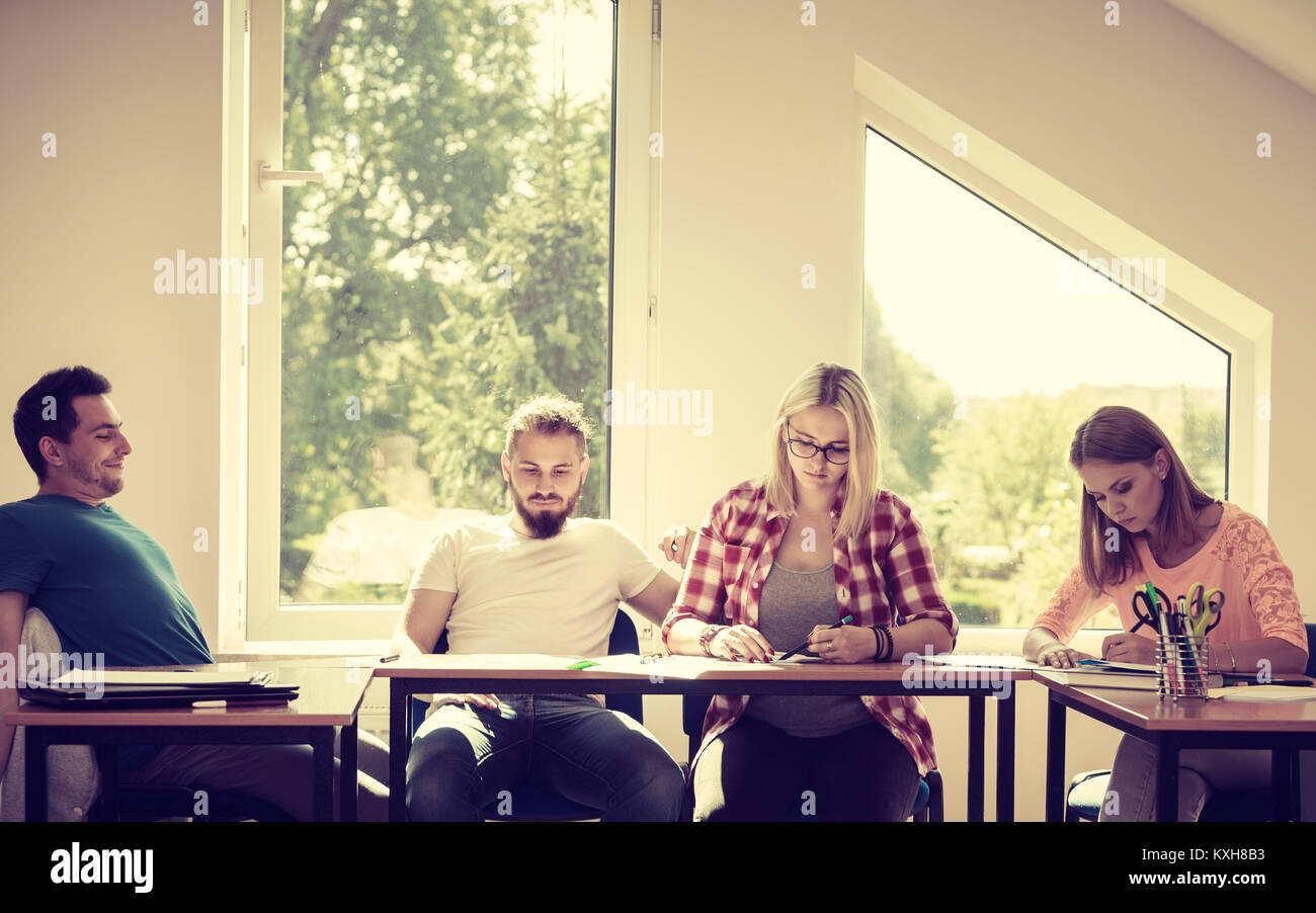 Group of young people sitting in class planning concept, studying ...