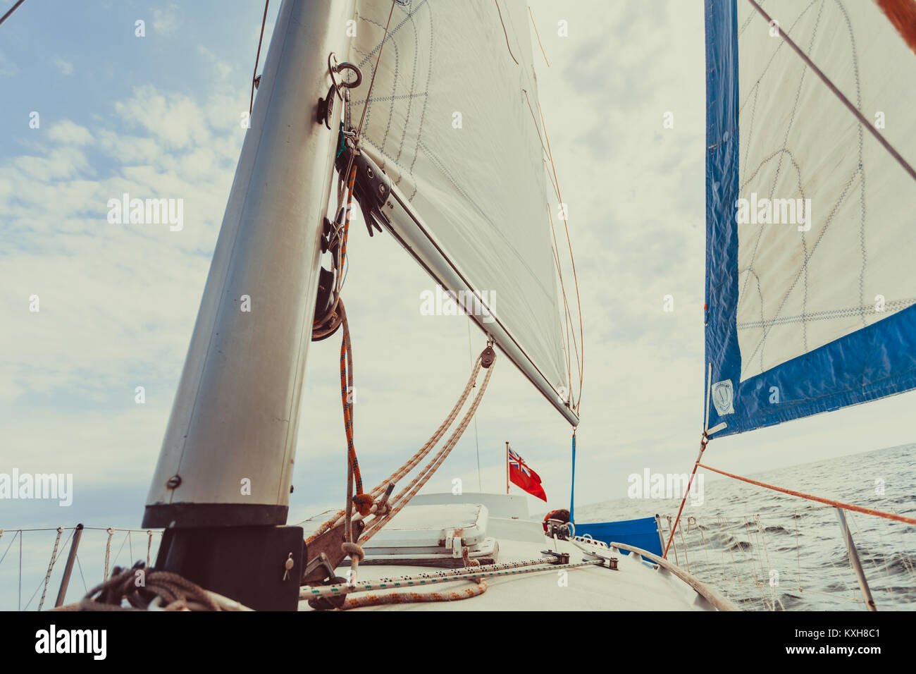 Detailed close up of down side of sail mast on boat during sea cruise ...