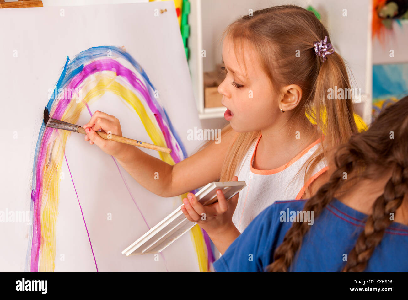 Small students children painting in art school class Stock Photo - Alamy