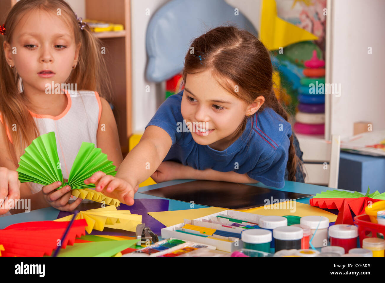 School children with scissors in kids hands cutting paper Stock Photo ...