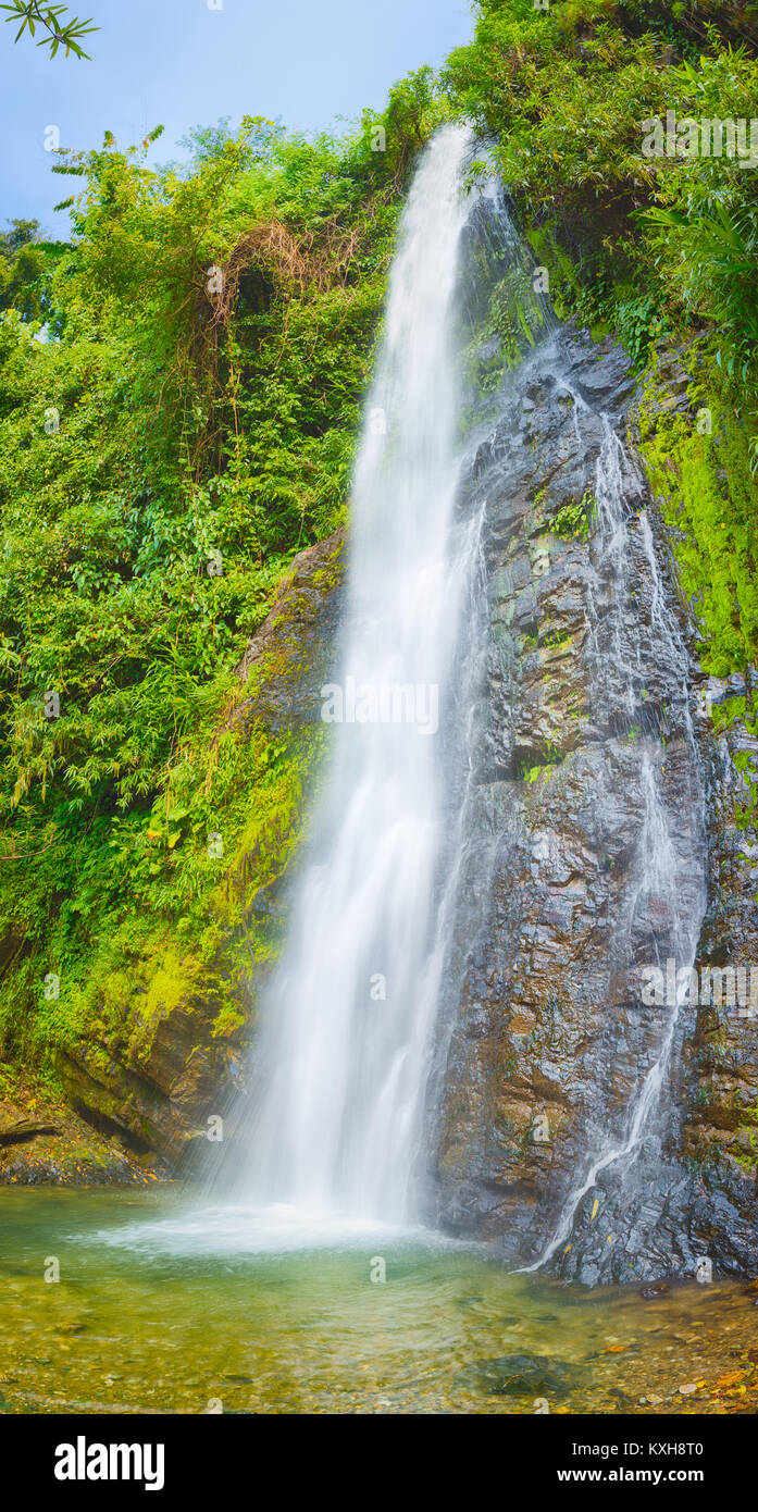 Beautiful Kaeng Nyui Waterfalls. Vang Vieng. Laos landscape. Vertical ...