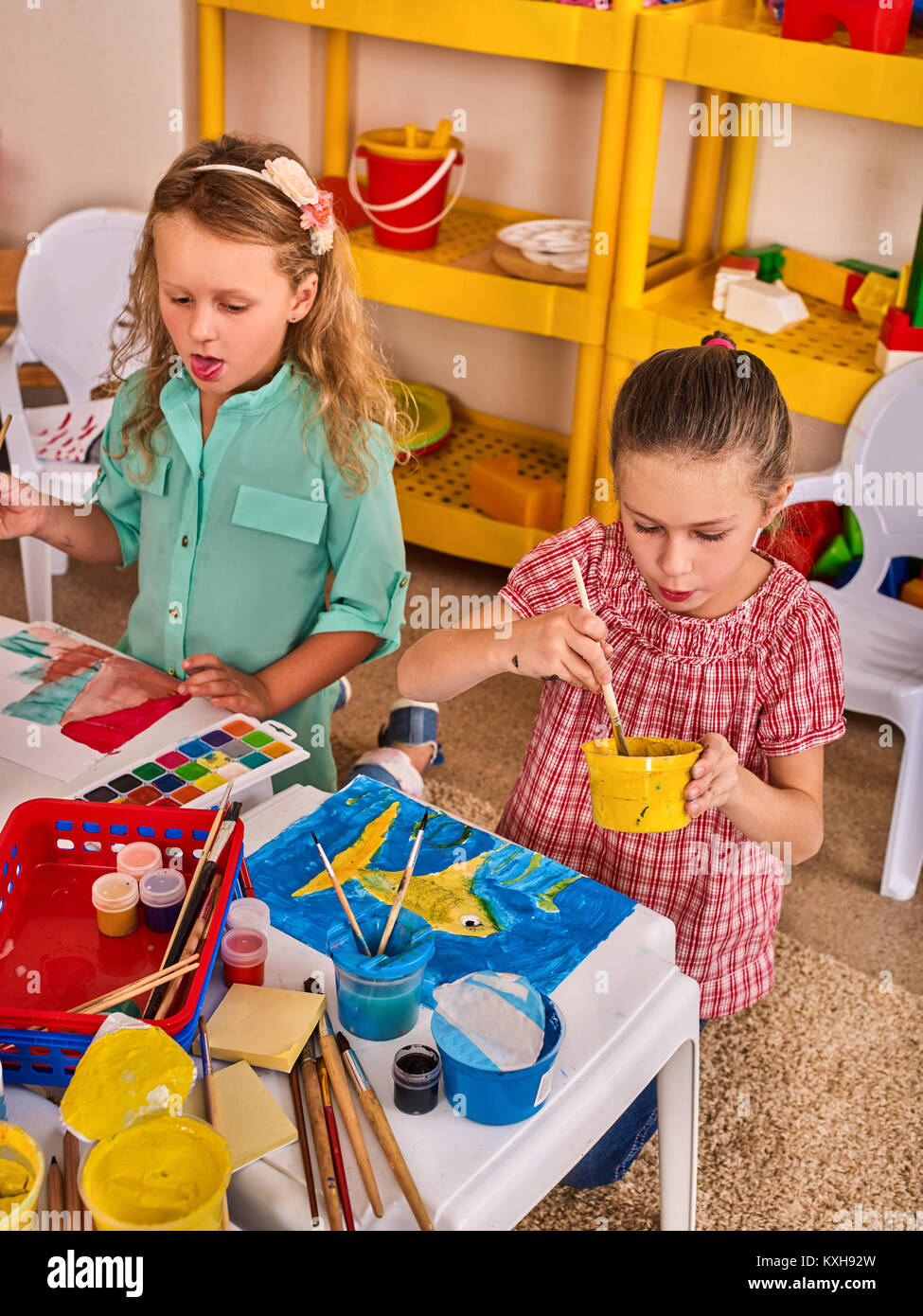 Small students children painting in art school class Stock Photo - Alamy