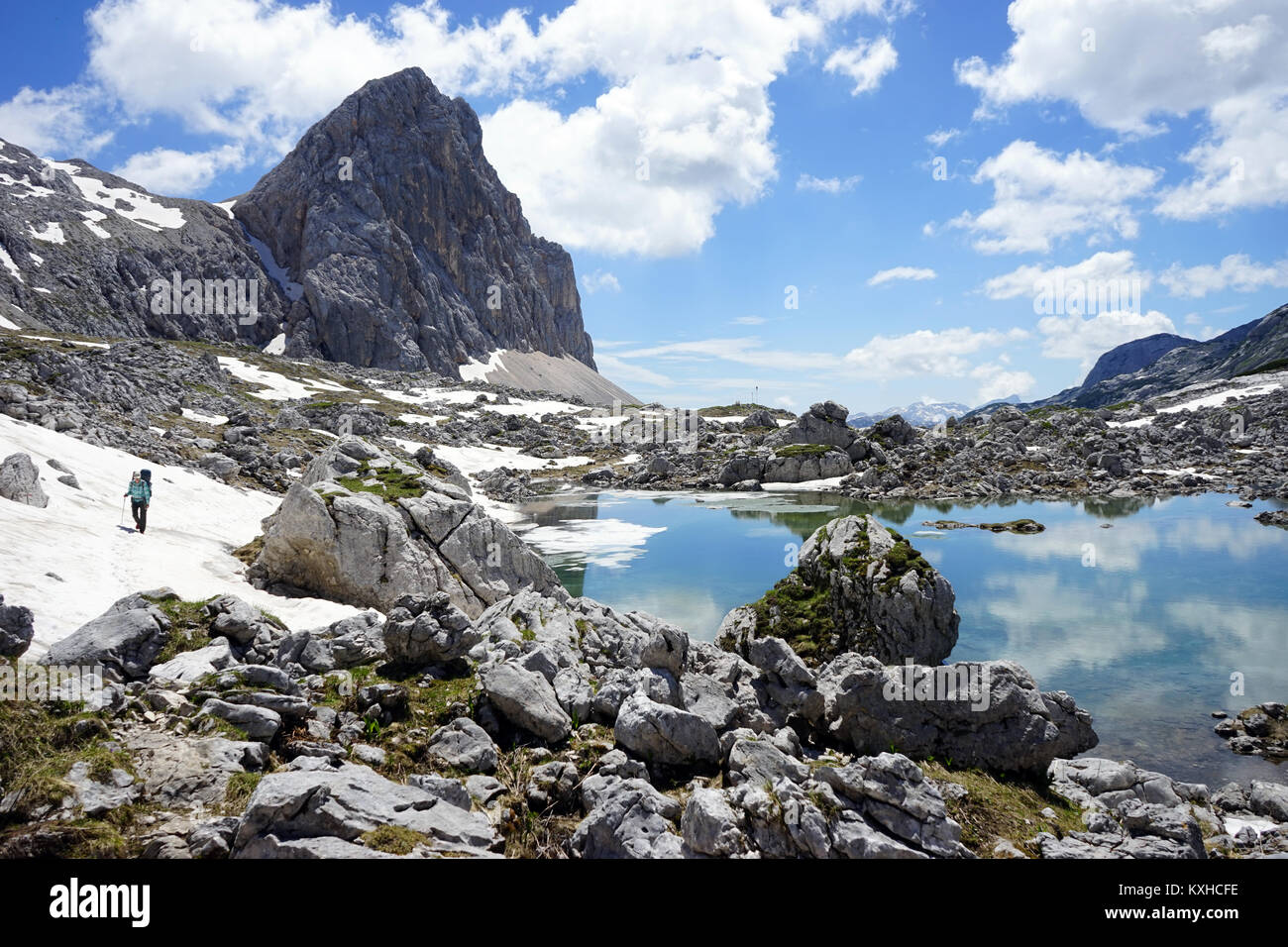 Backpacker on the Via Alpina trail on the Triglav mount in Slovenia ...