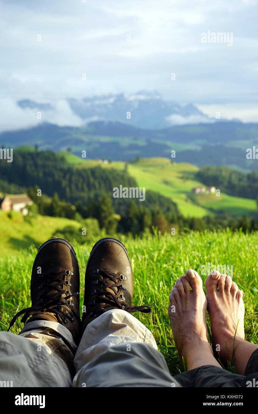 two legs - boots and barefoot Stock Photo - Alamy