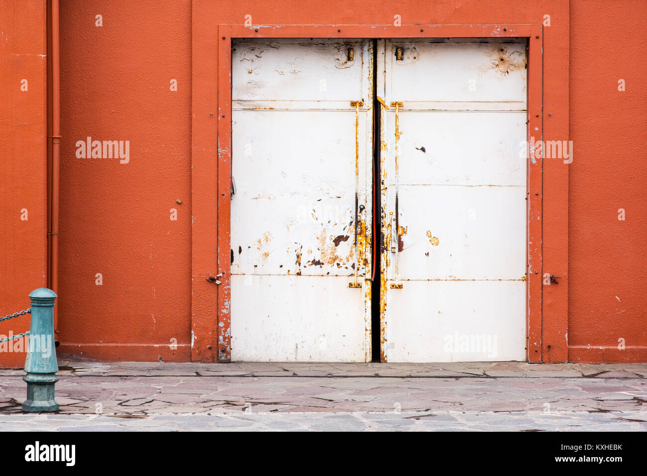facade of old warehouse with white sliding doors Stock Photo - Alamy