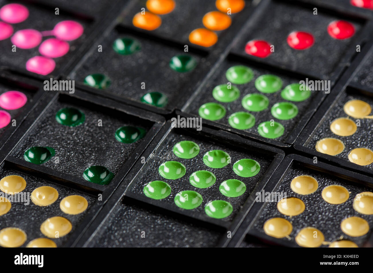 Dominoes on wooden table. Dominoes is a game played with rectangular ...