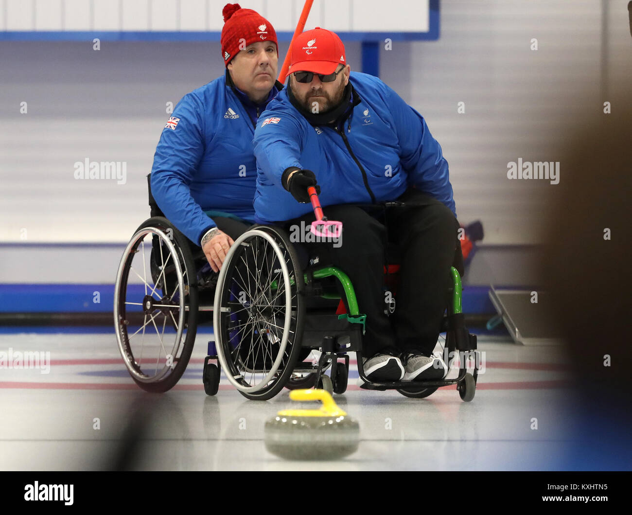 Greta Briatin's Curler Robert McPherson watches Gregor Ewan throw a ...