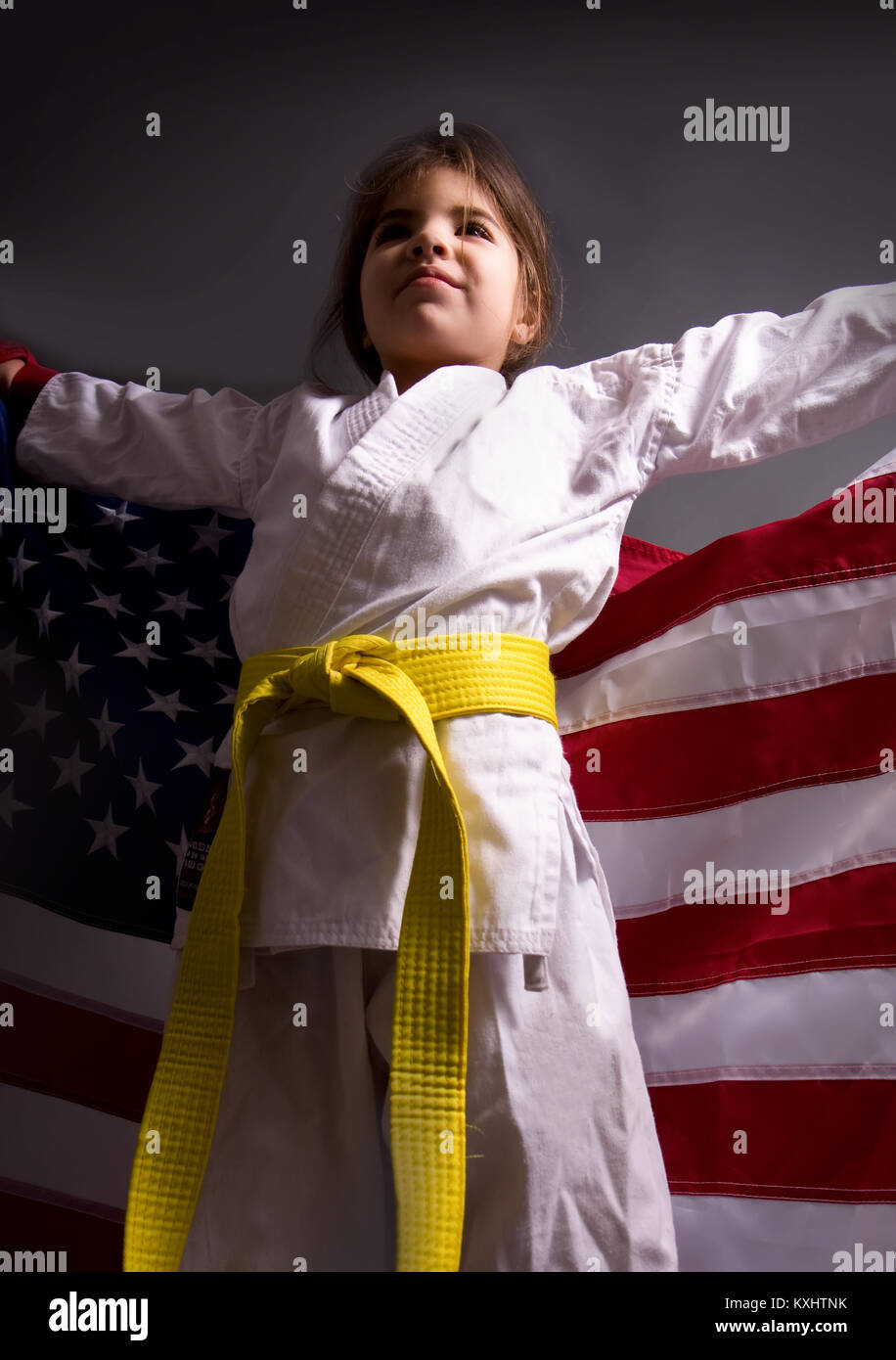 Girl karate with a flag Stock Photo - Alamy