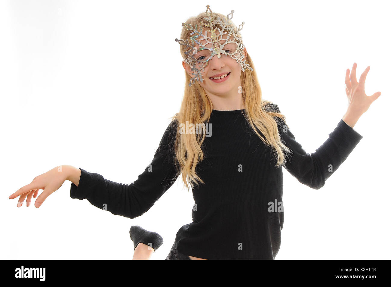 pretty blonde Caucasian girl dancing, wearing a Christmas snowflake ...