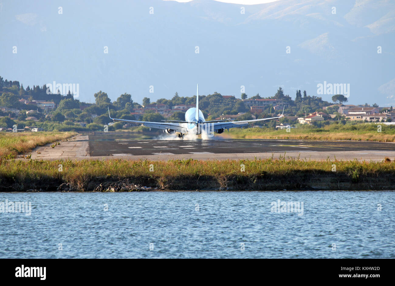 passenger airplane landing on Corfu airport summer season Stock Photo ...