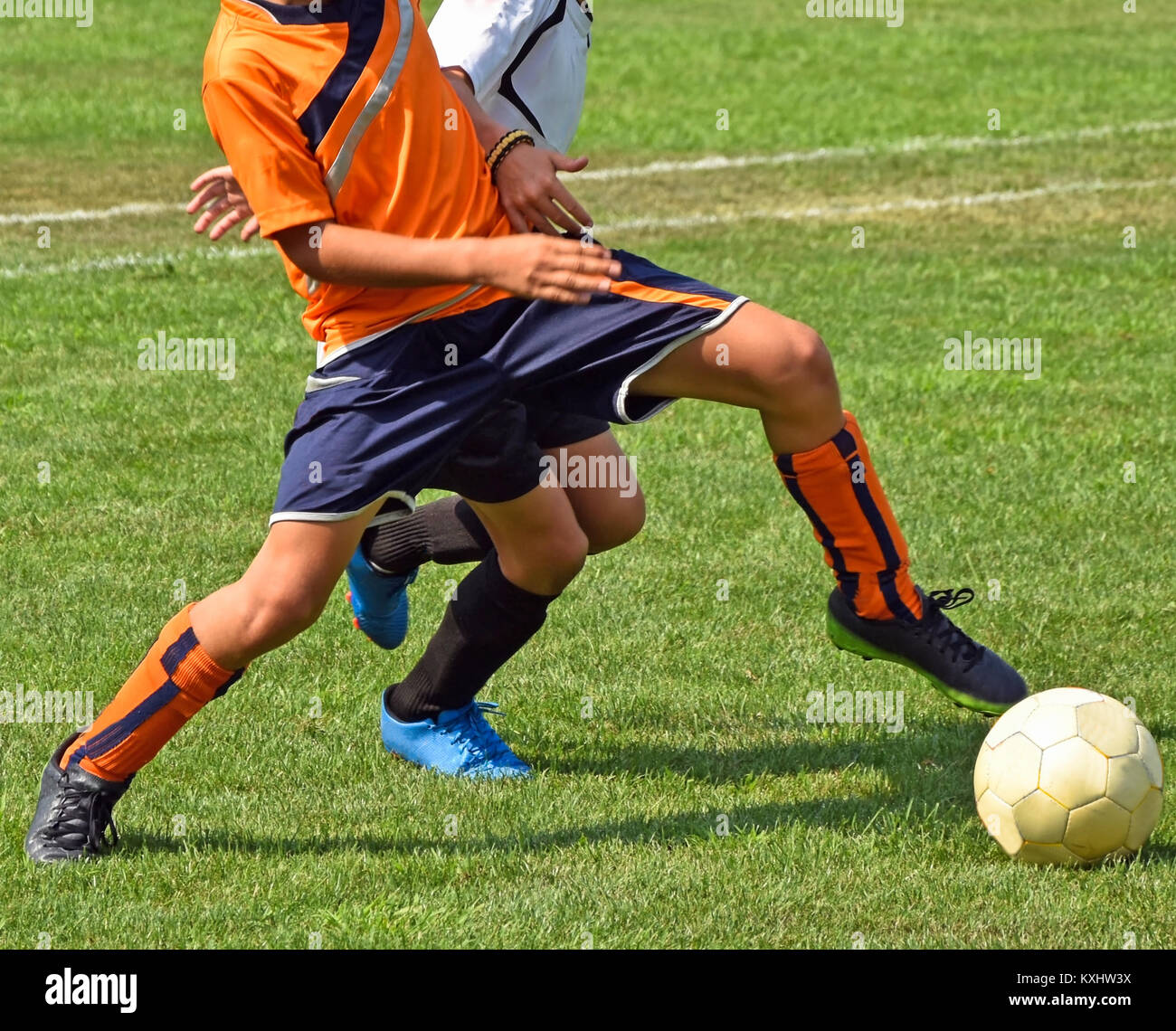 Kids are playing soccer outdoor Stock Photo - Alamy