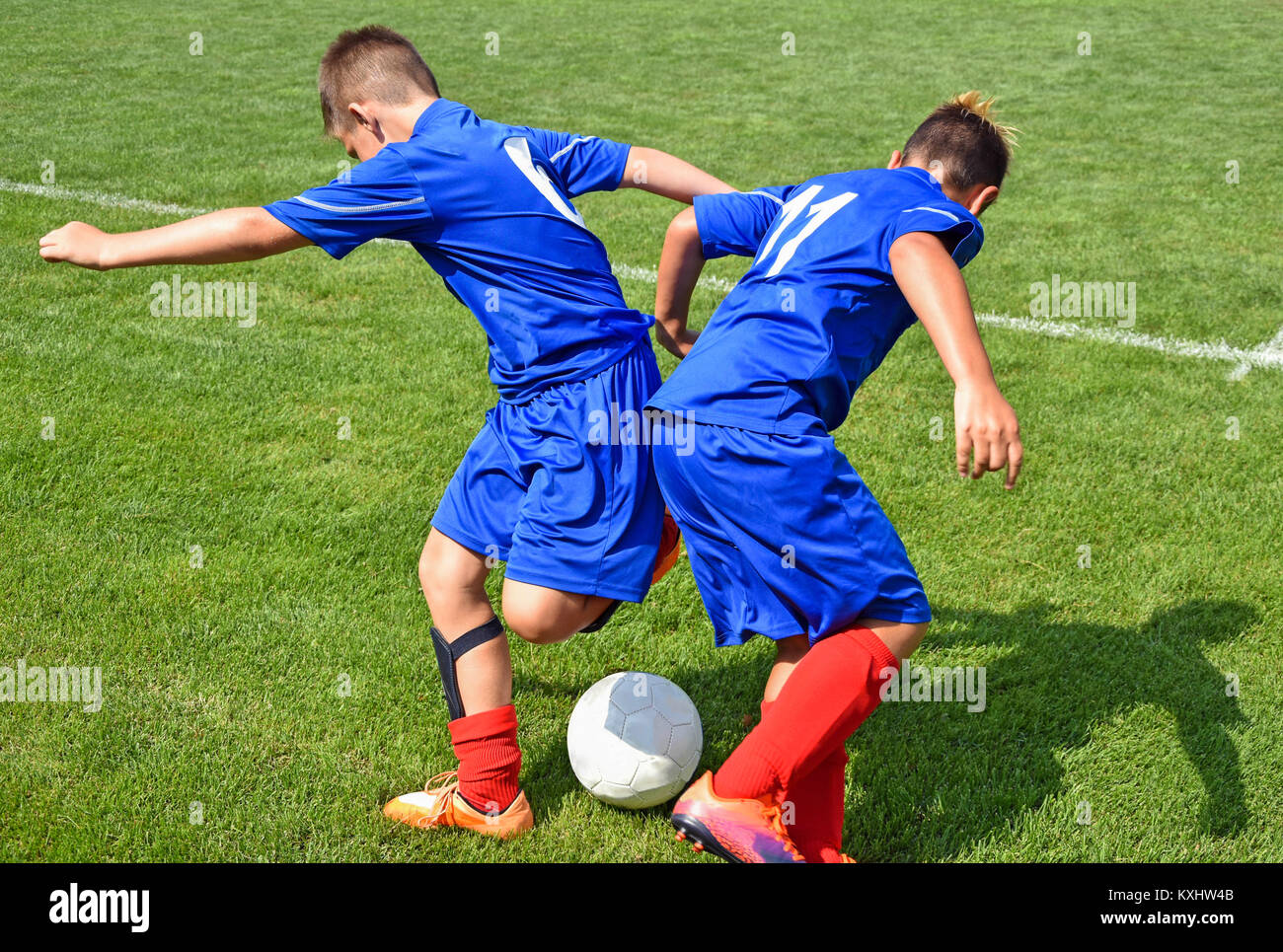 Kids are playing soccer outdoor Stock Photo - Alamy