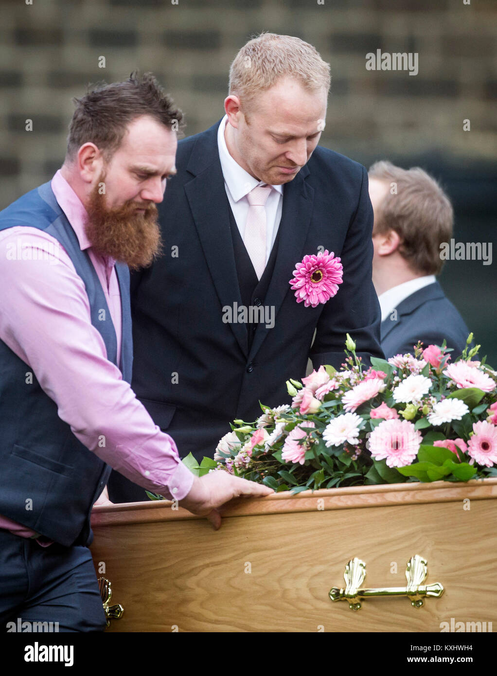 Malcolm Willsher (right) takes the coffin of his wife, Jodie, who was ...