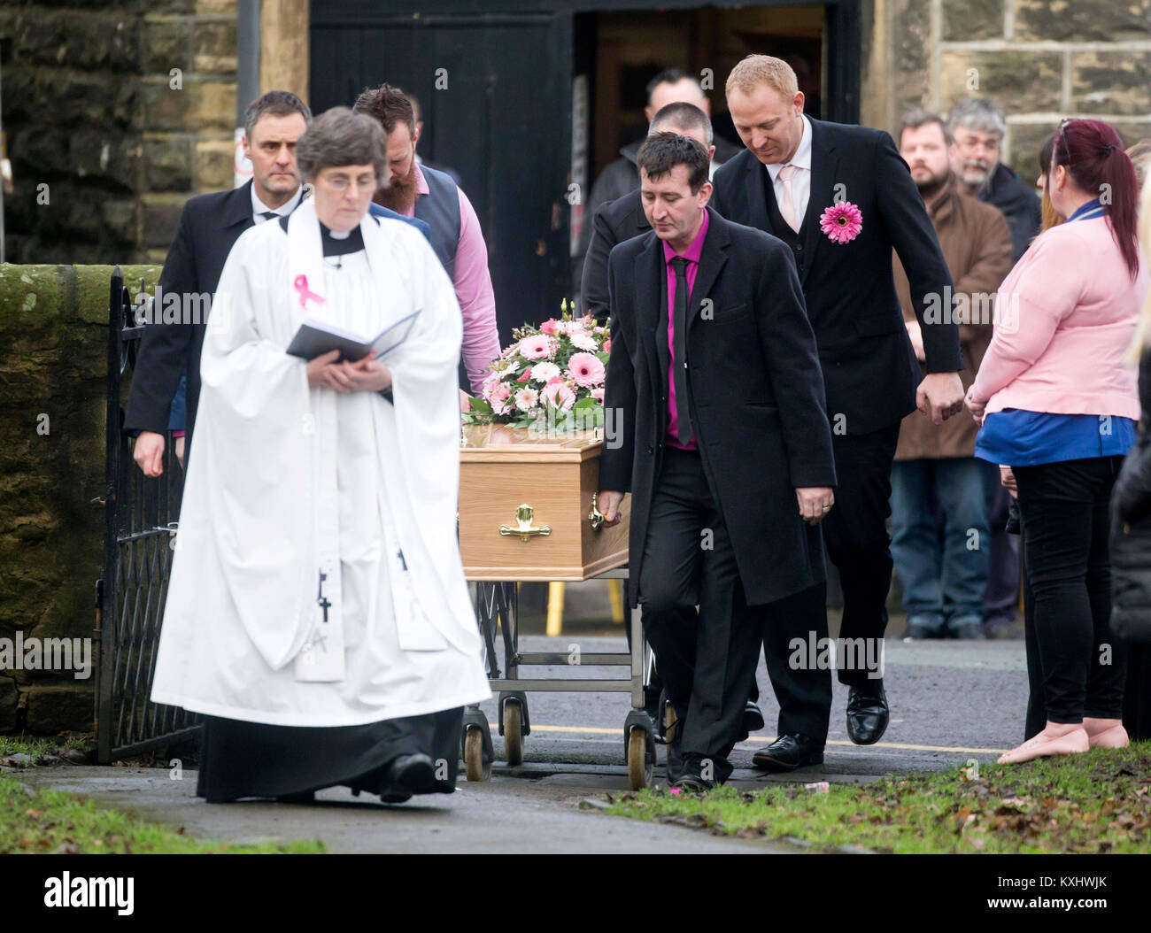 Malcolm Willsher (rear right) takes the coffin of his wife, Jodie, who ...