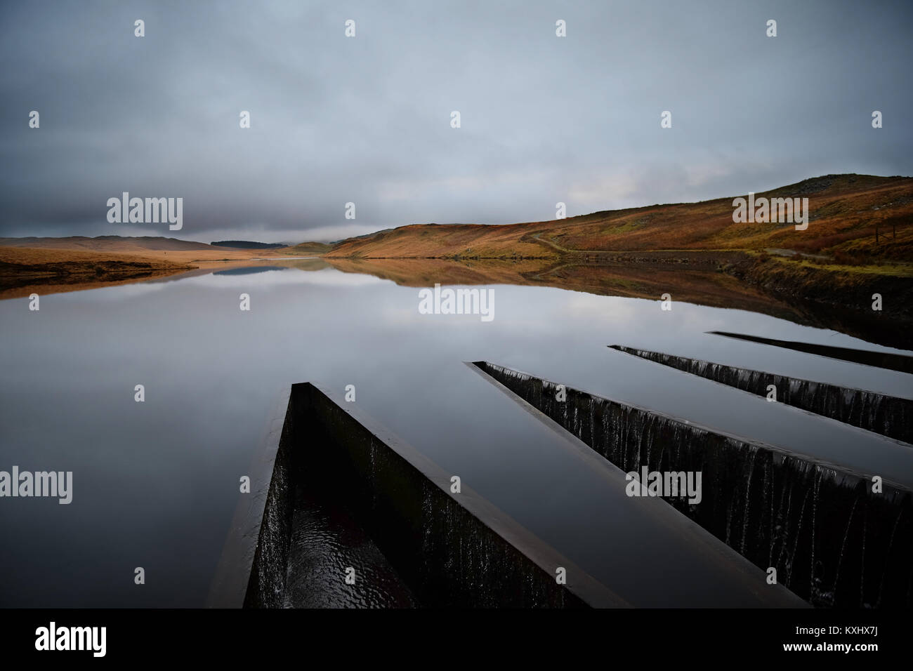 Craig y pistyll dam on a still overcast day Stock Photo - Alamy