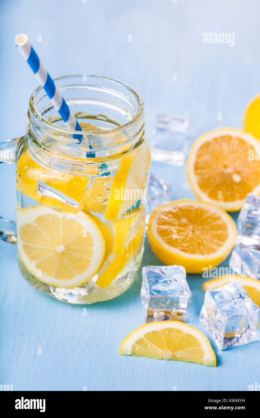 Refreshing ice cold water with lemon ready to drink. Concept of diet ...