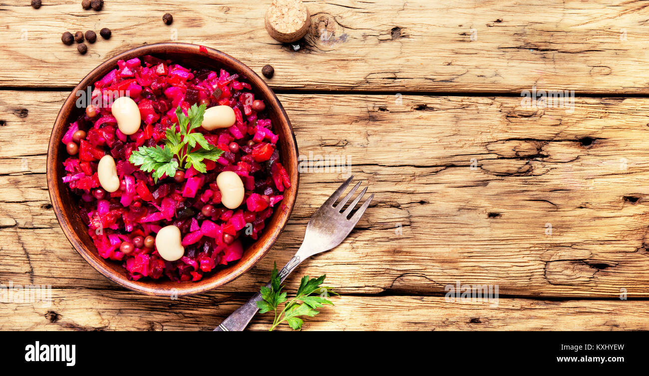 Traditional vegetarian russian beetroot salad vinaigrette in rustic ...