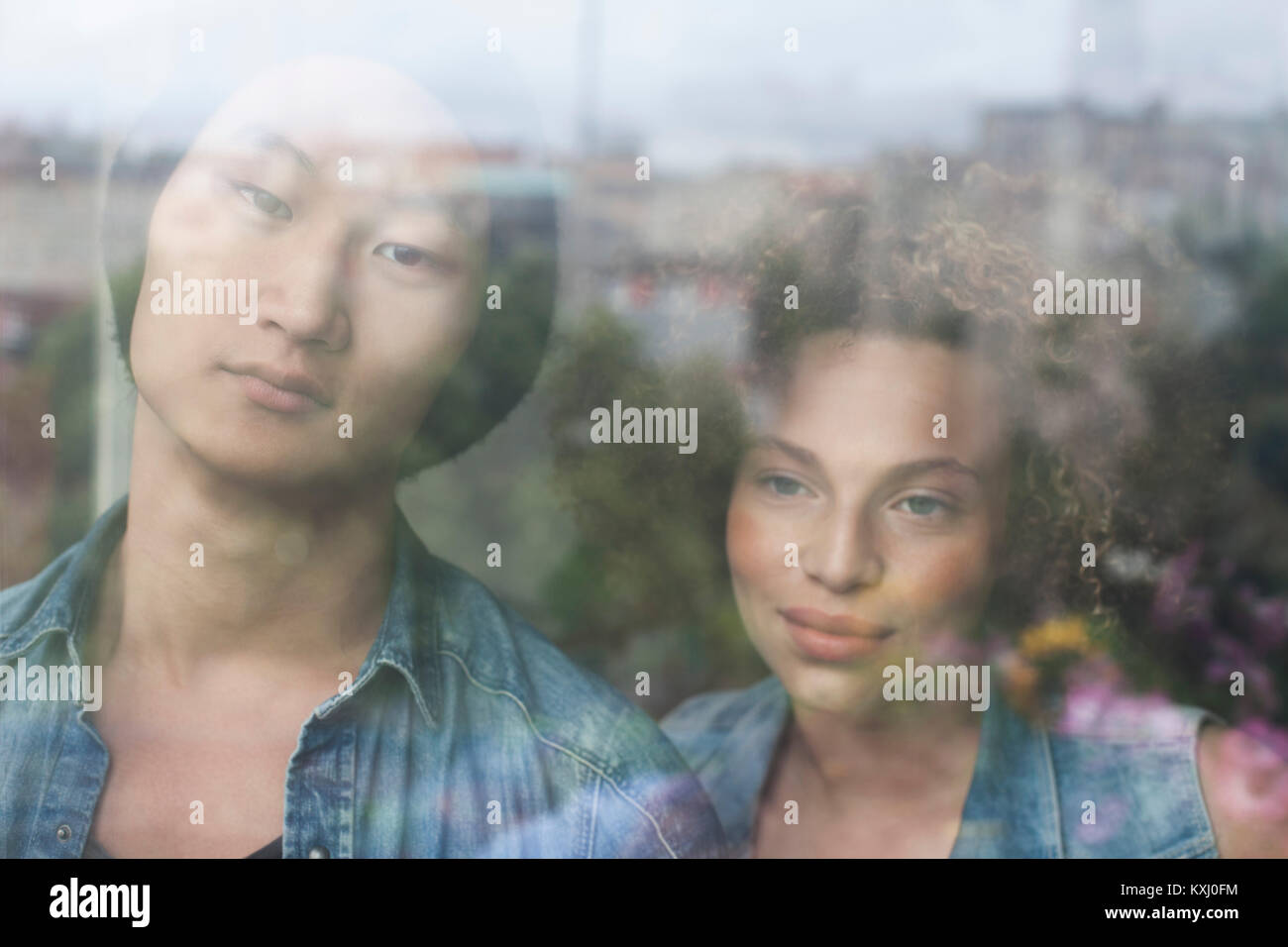 Close-up of couple seen through glass window Stock Photo - Alamy
