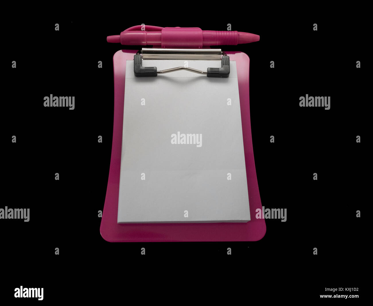 Small red Notepad isolated on black background Stock Photo - Alamy